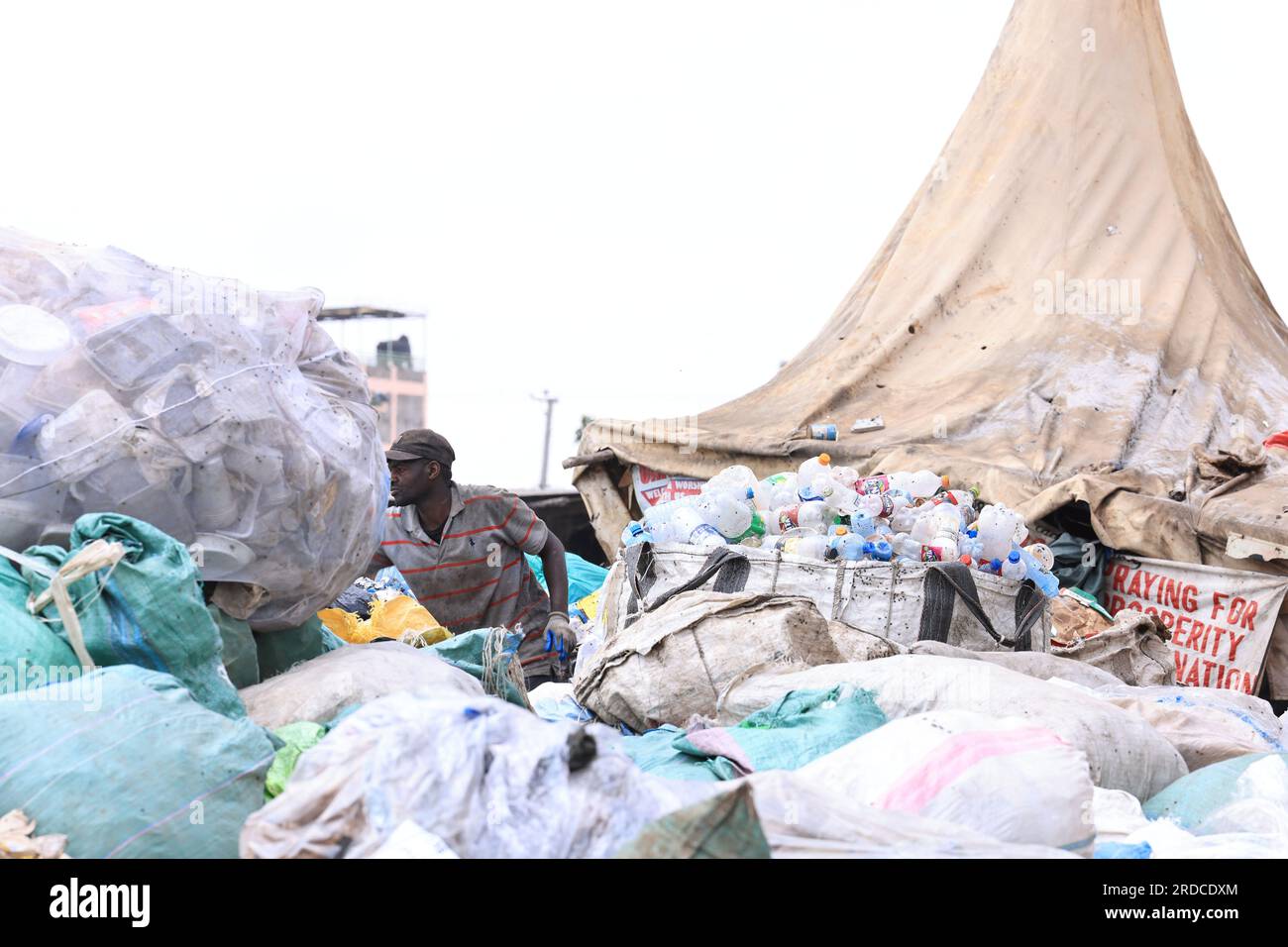 Nairobi, Kenya. 14th July, 2023. A man seen working on his collected ...