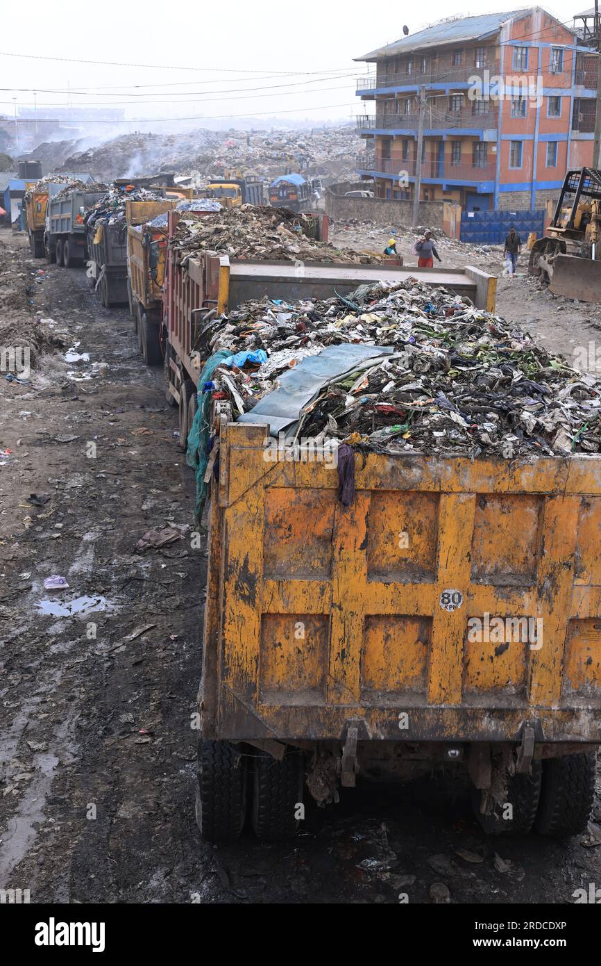 Nairobi, Kenya. 14th July, 2023. Garbage trucks wait at the weigh ...