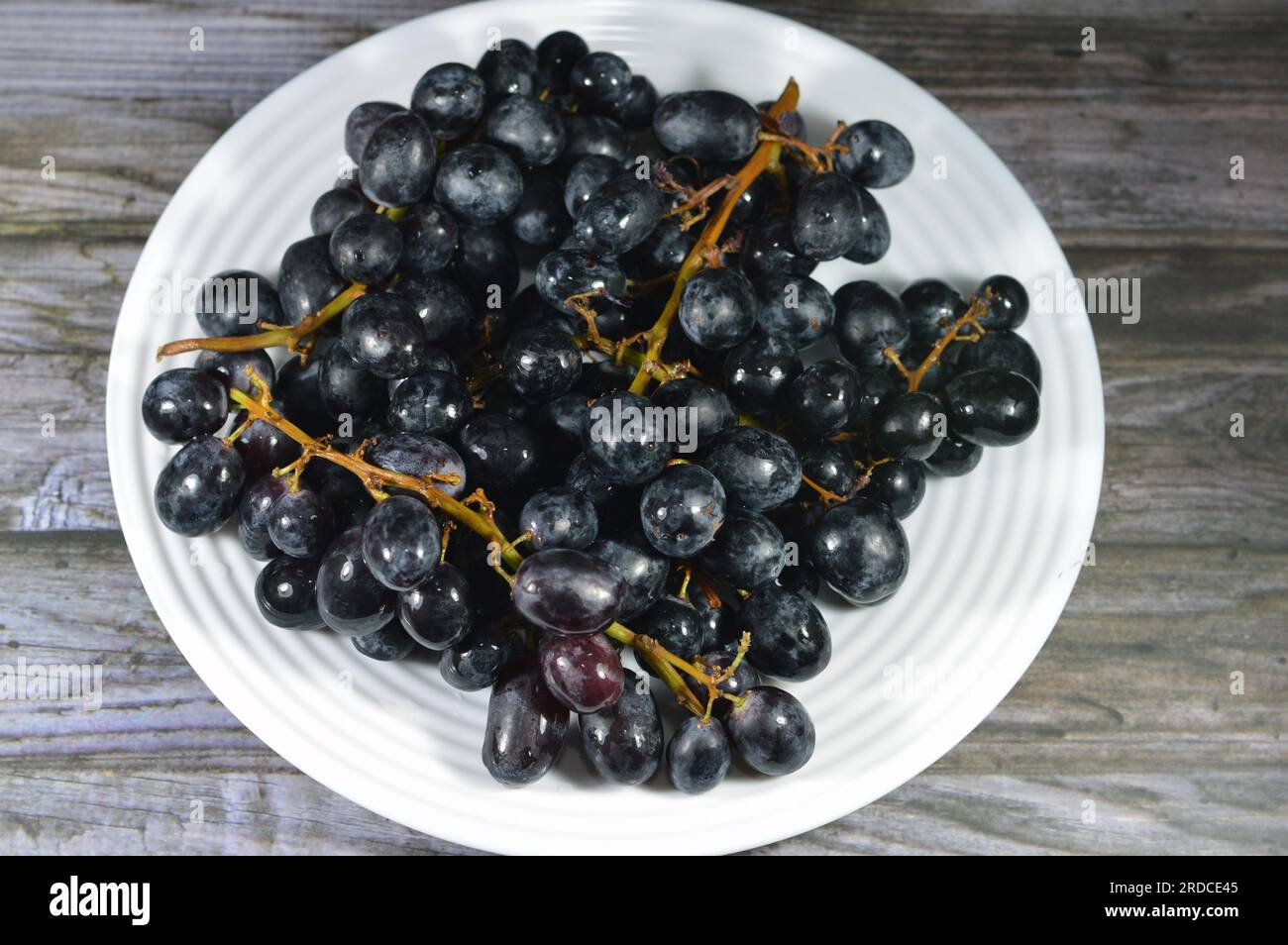 Black grapes, a fruit, botanically a berry of the deciduous woody vines ...