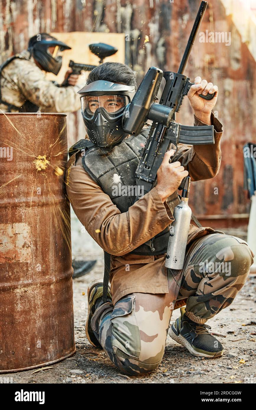 Paintball, soldier and man with gun for tournament, competition and ...
