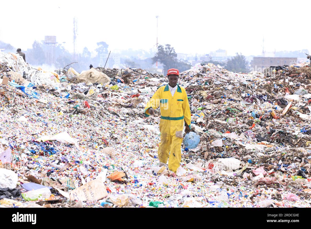 Nairobi, Kenya. 14th July, 2023. A man seen walking through garbage at ...