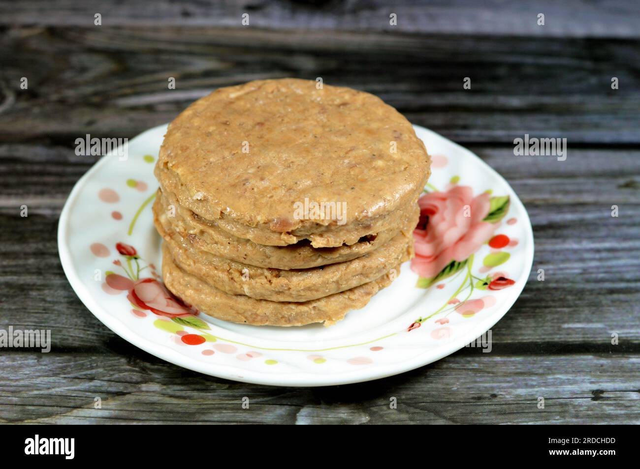 Raw uncooked beef burger ready to be cooked and fried in shallow oil ...