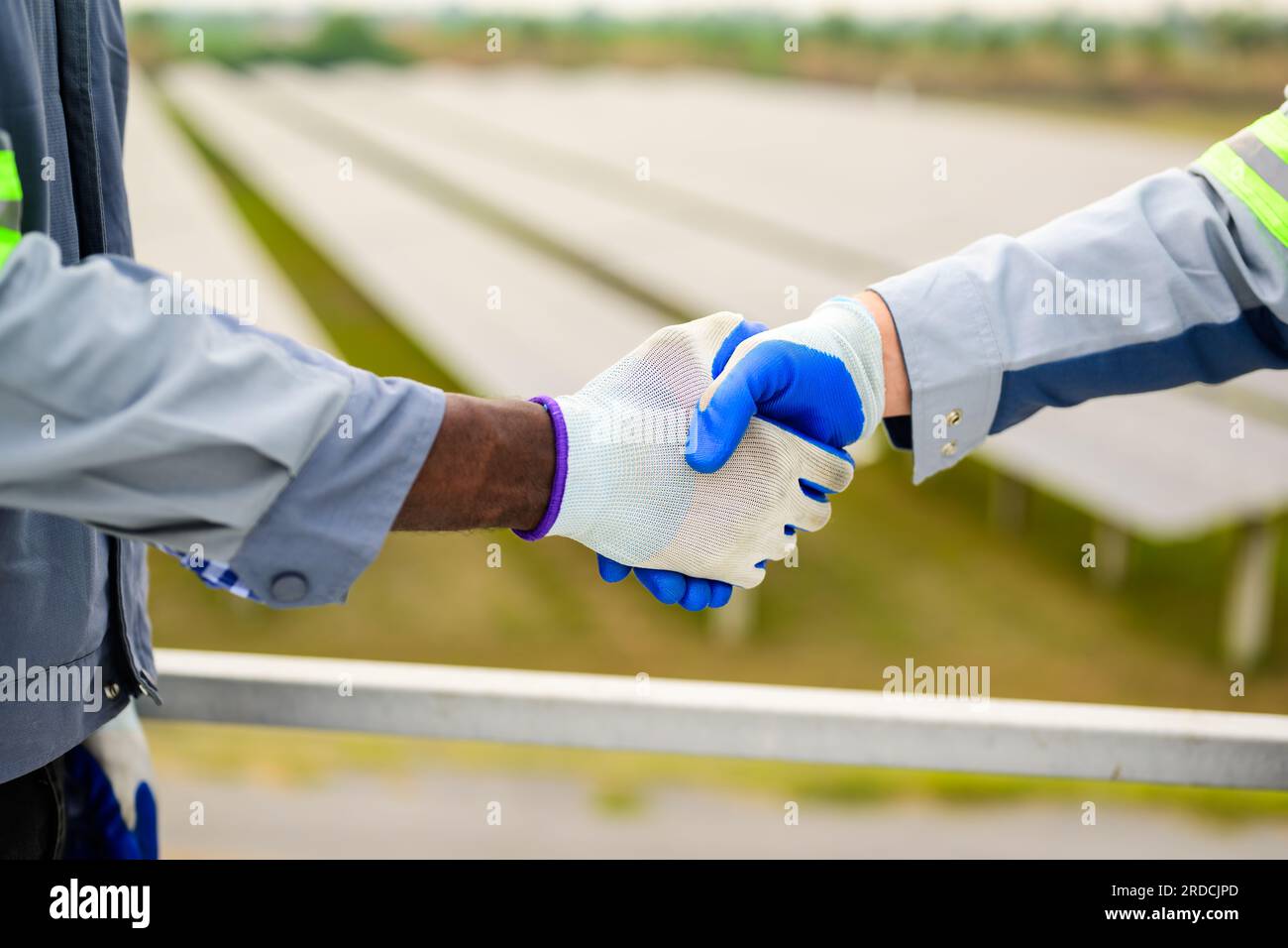 Maintenance engineers working with teamwork at ecological solar farm ...