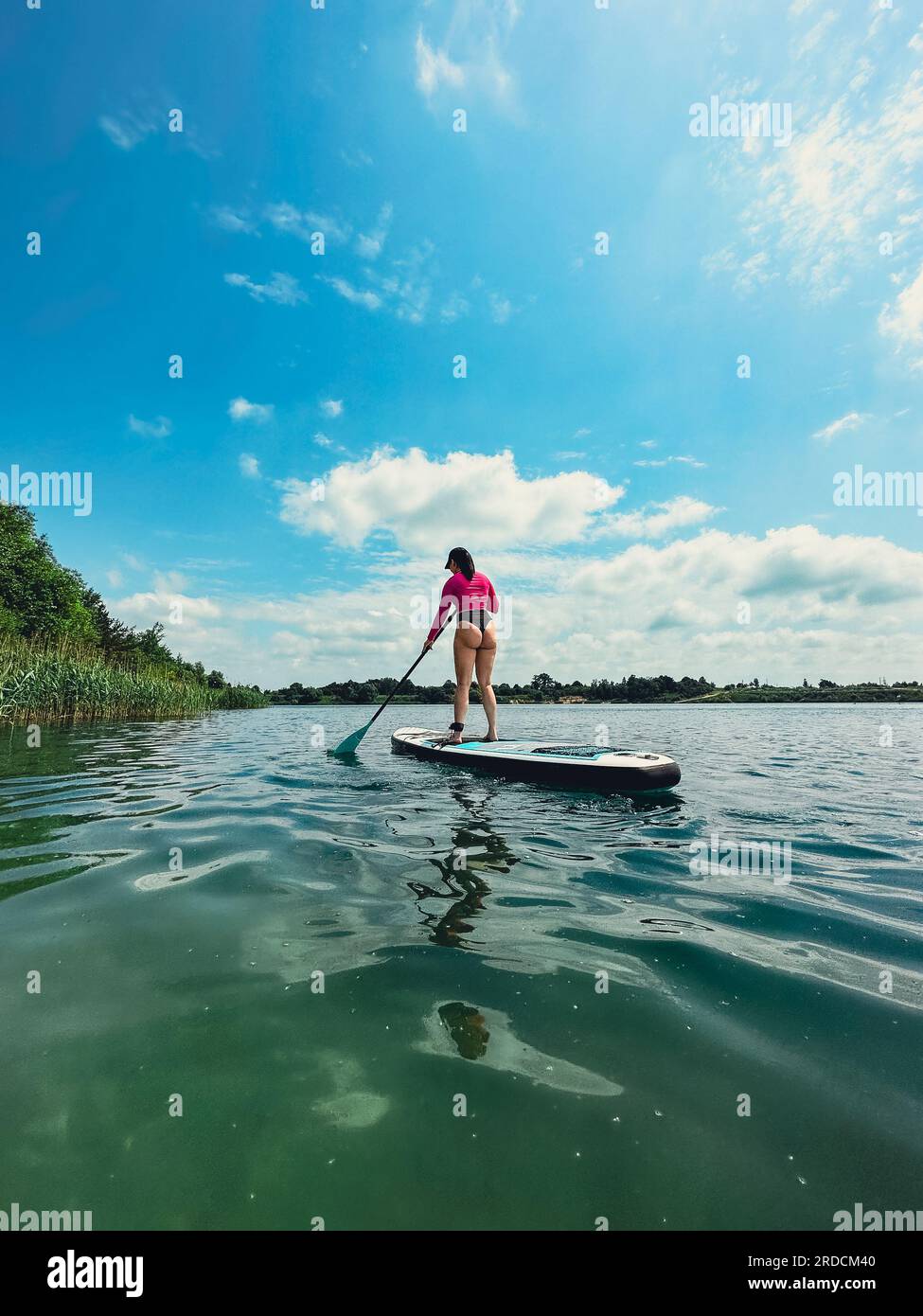beautiful woman standing on supboard keep balance Stock Photo - Alamy