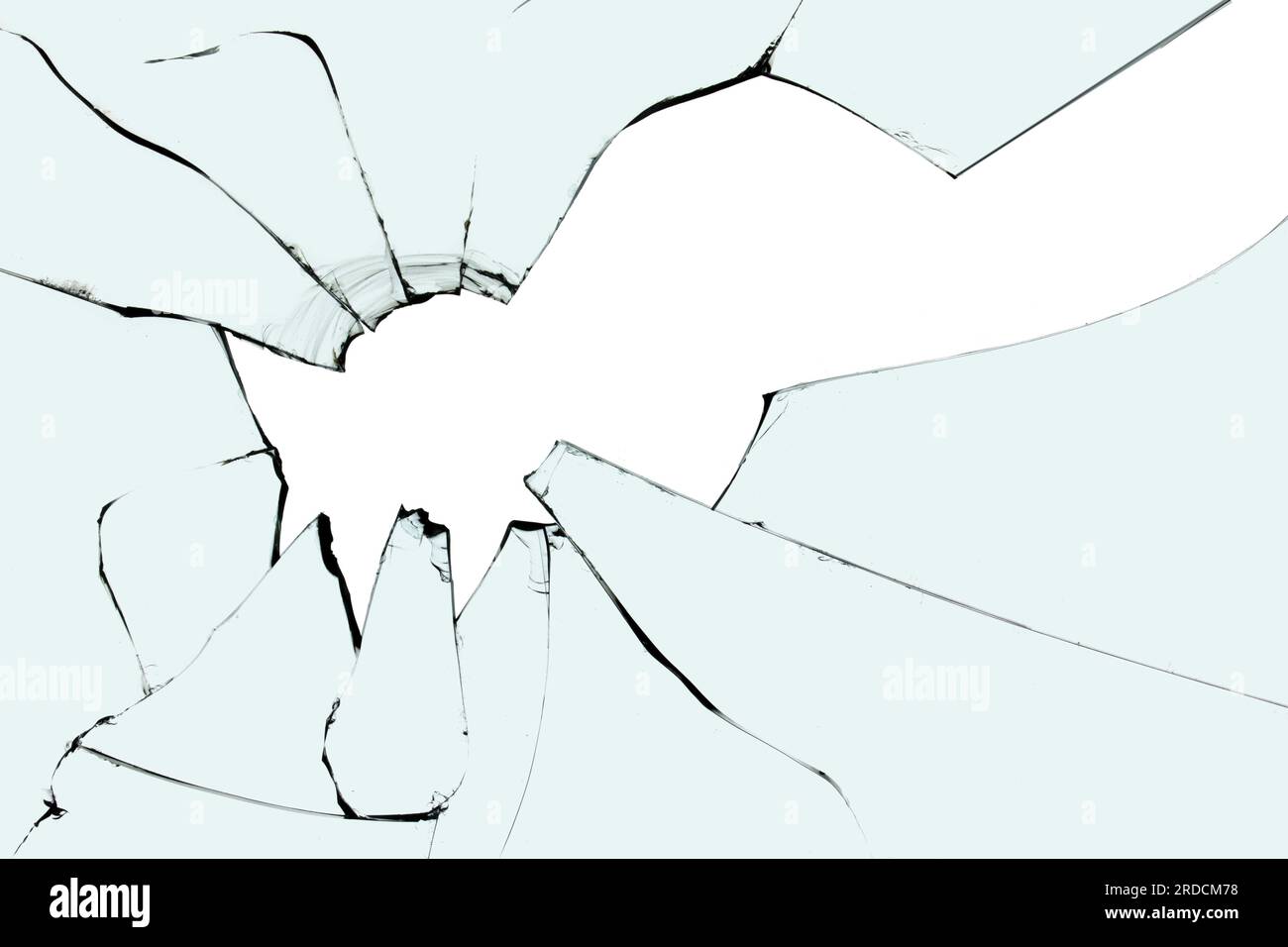 Broken glass texture crack with a hole in the center of the window on a ...