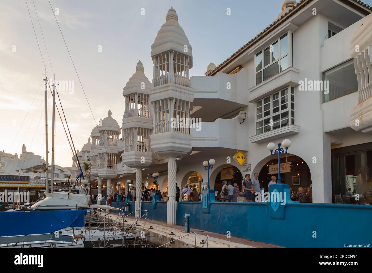 People enjoy the restaurants, bars and shops in the evening at the ...