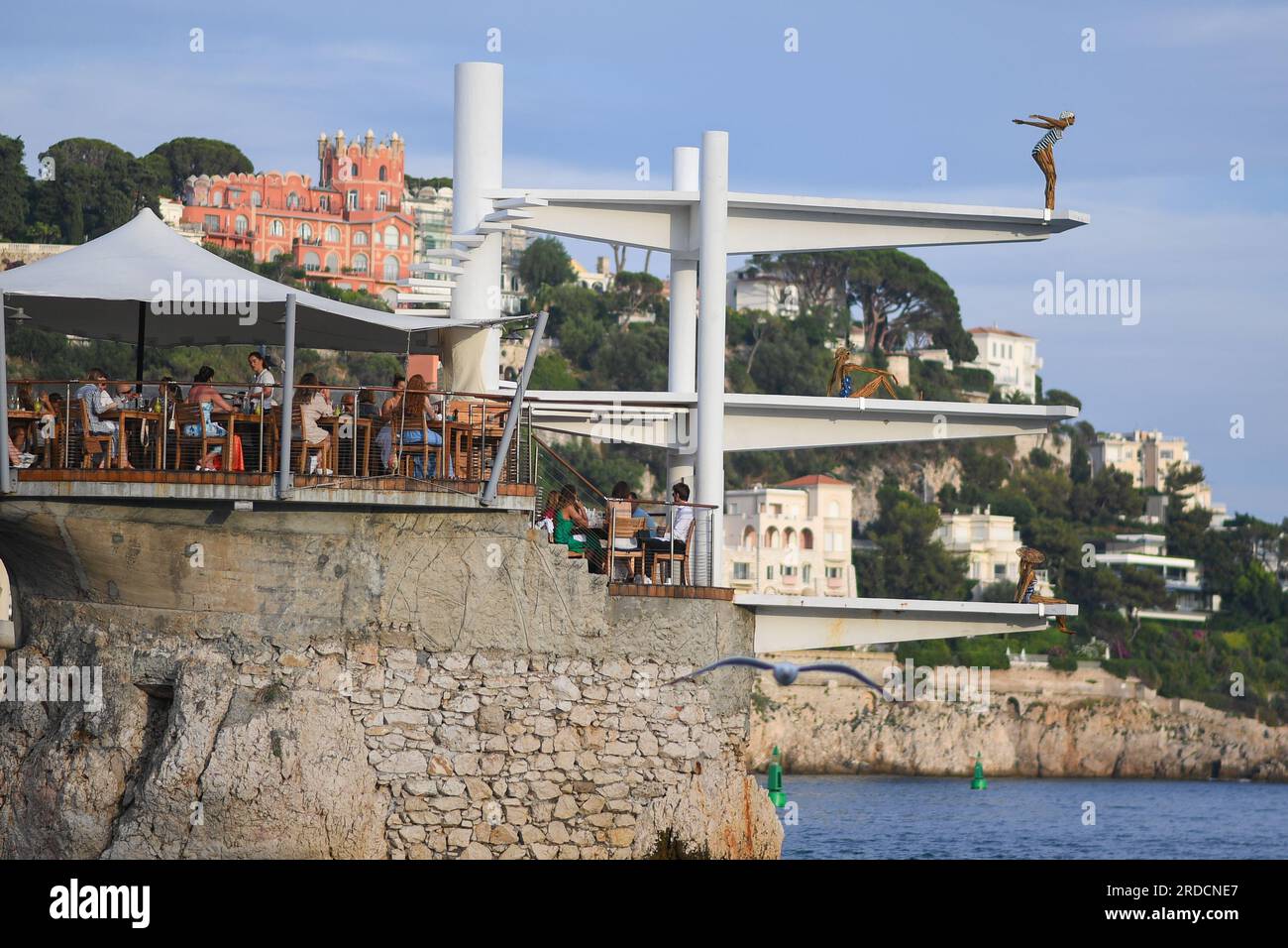 Nice, France. 13th July, 2023. A person stands on a diving board at The ...