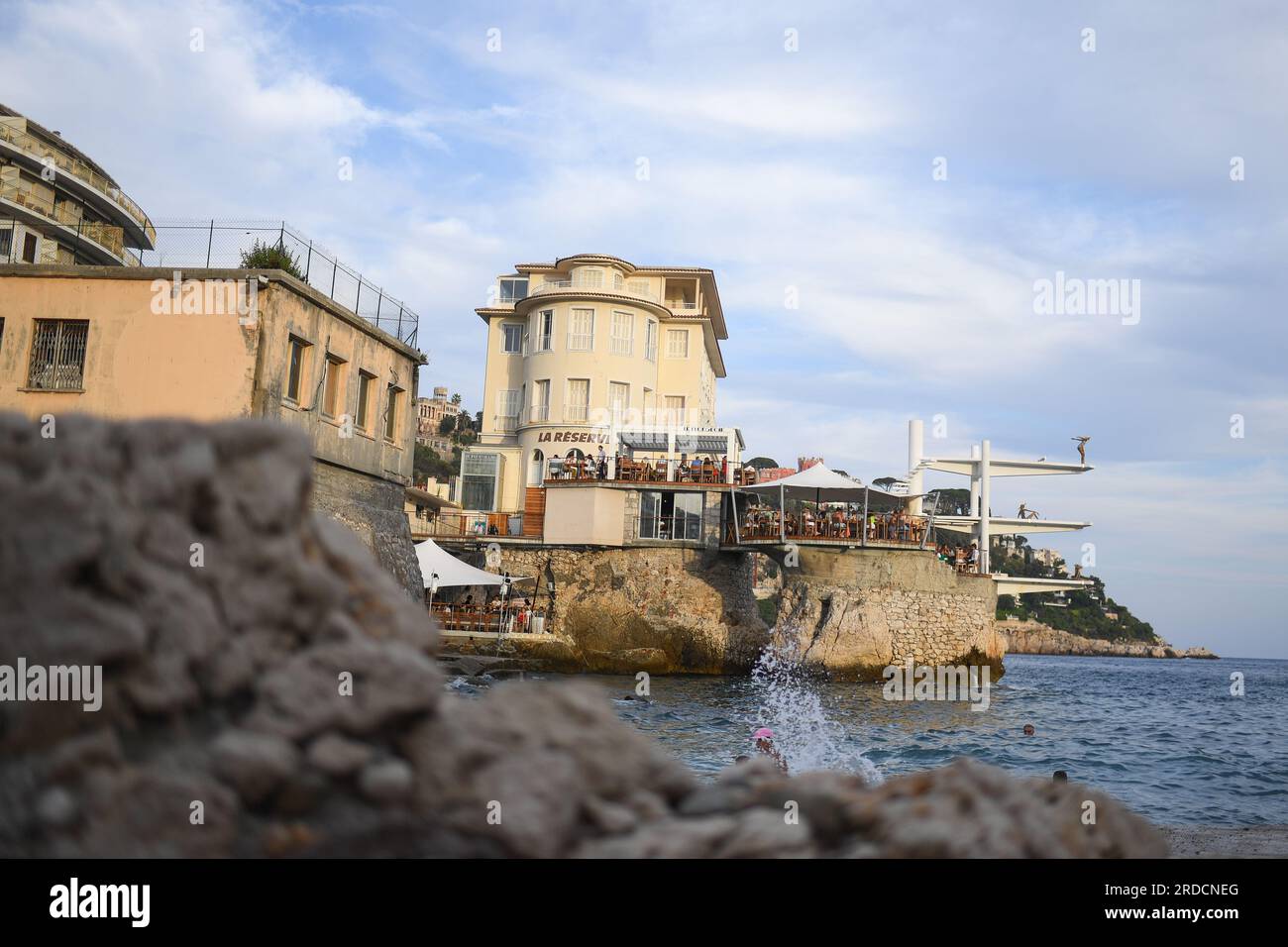Nice, France. 13th July, 2023. A person stands on a diving board at The ...