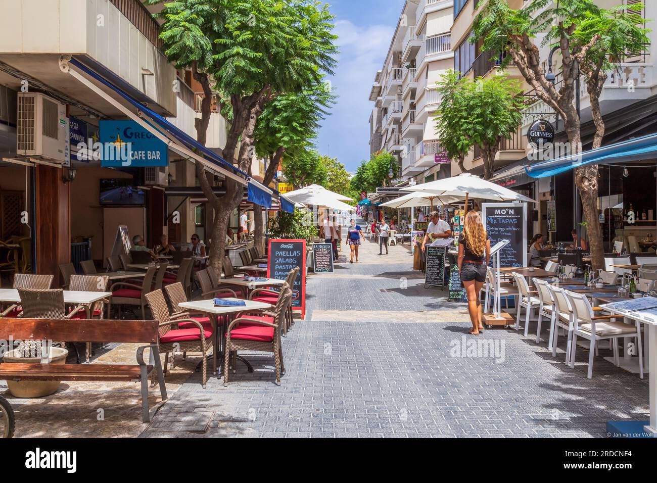 Cozy street with many terraces in the center of Alcúdia on the Spanish ...