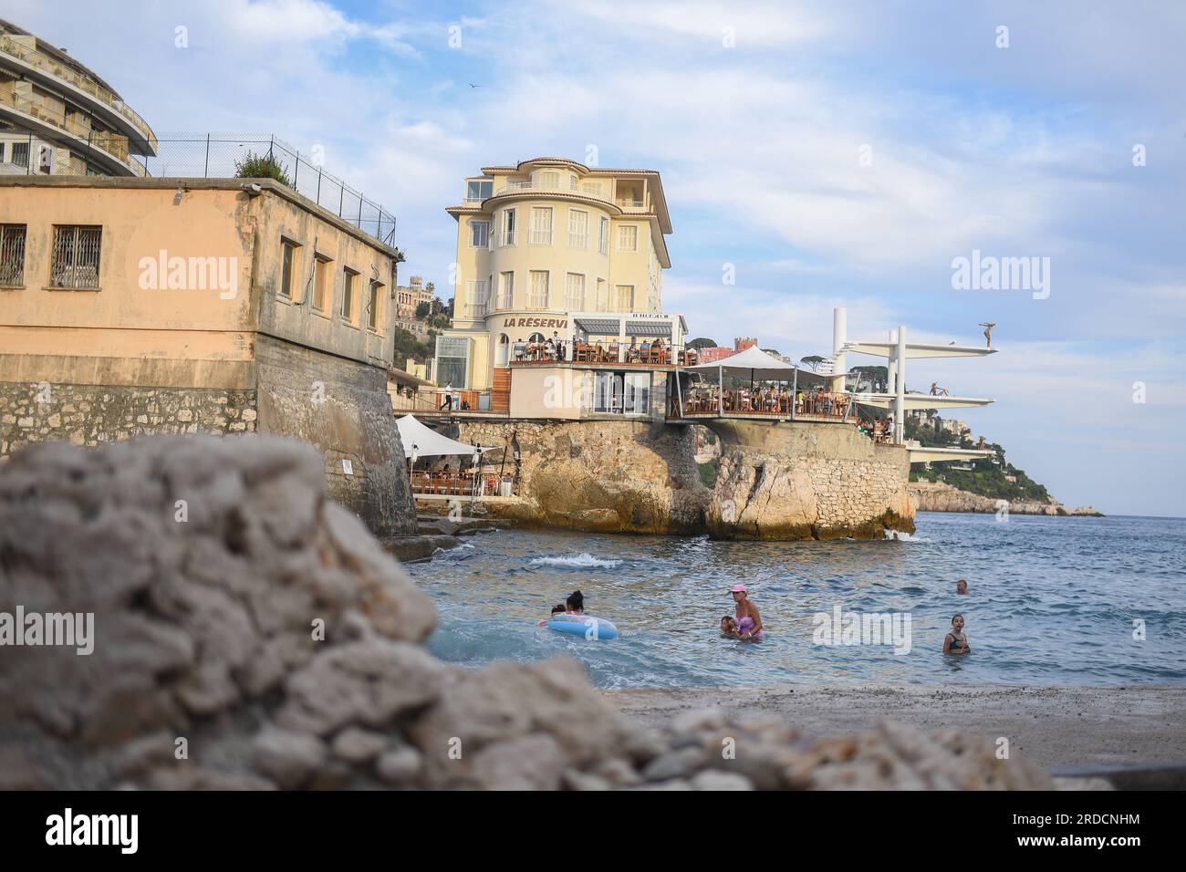 Nice, France. 13th July, 2023. A person stands on a diving board at The ...