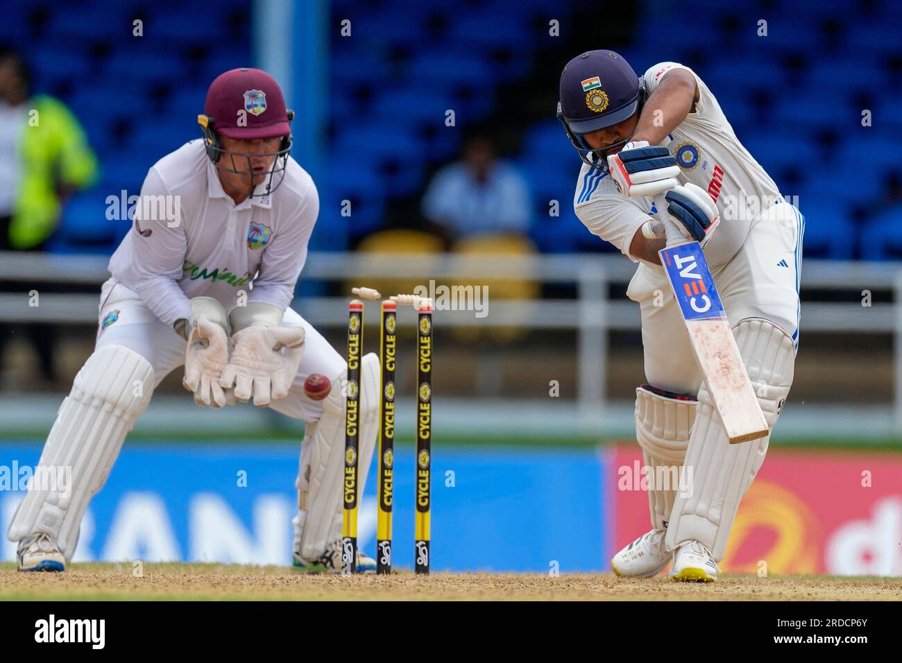 India's captain Rohit Sharma is bowled by Jomel Warrican for 80 runs on ...