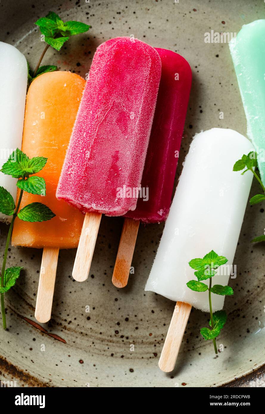 group of colored ice cream on a stick on white. summer dessert Stock ...