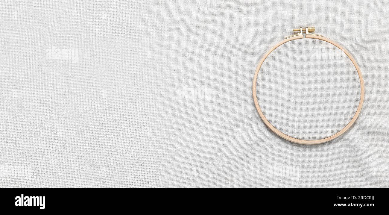 Wooden embroidery hoop with canvas. Banner for design Stock Photo - Alamy