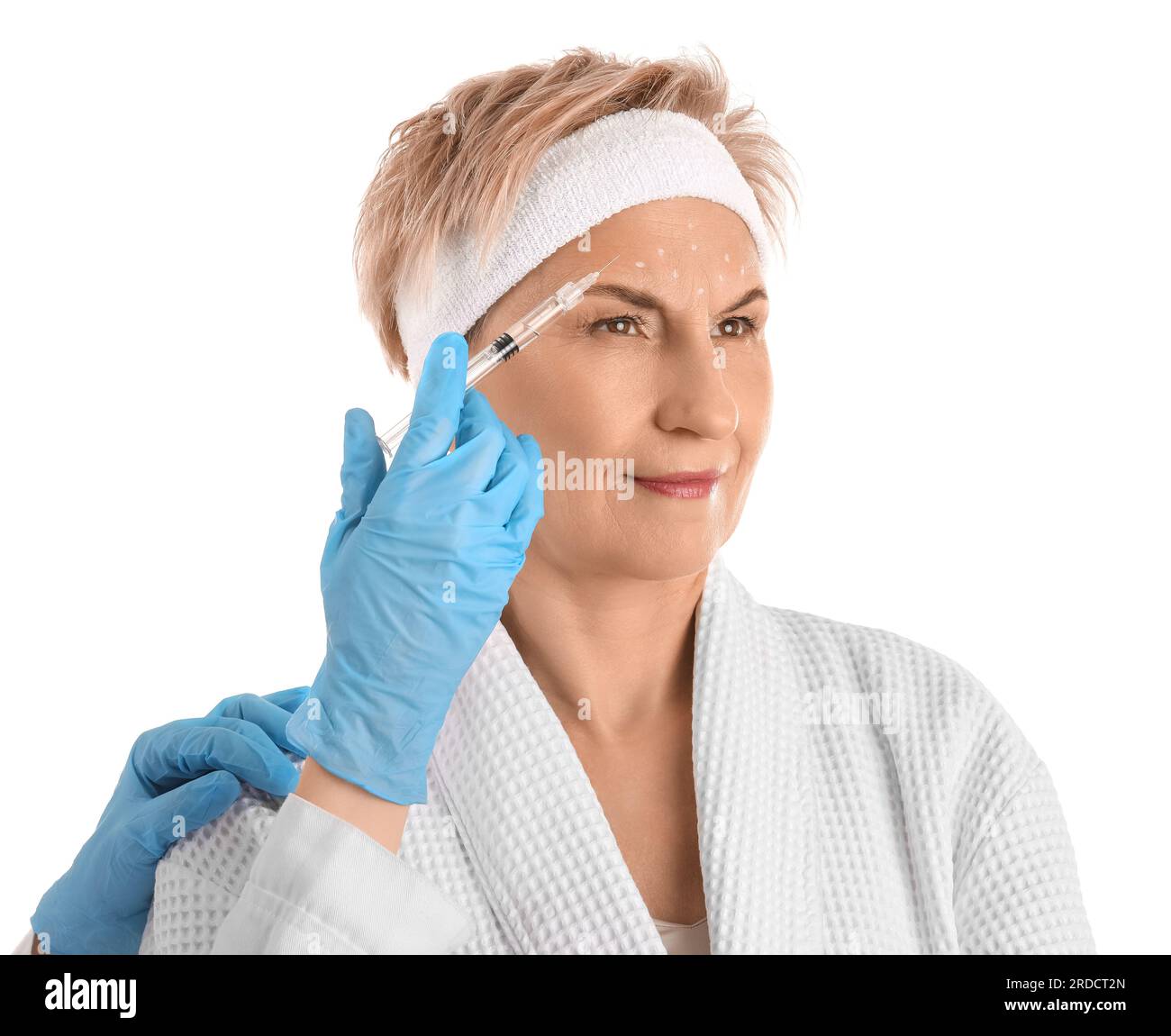 Mature woman receiving filler injection on white background, closeup ...