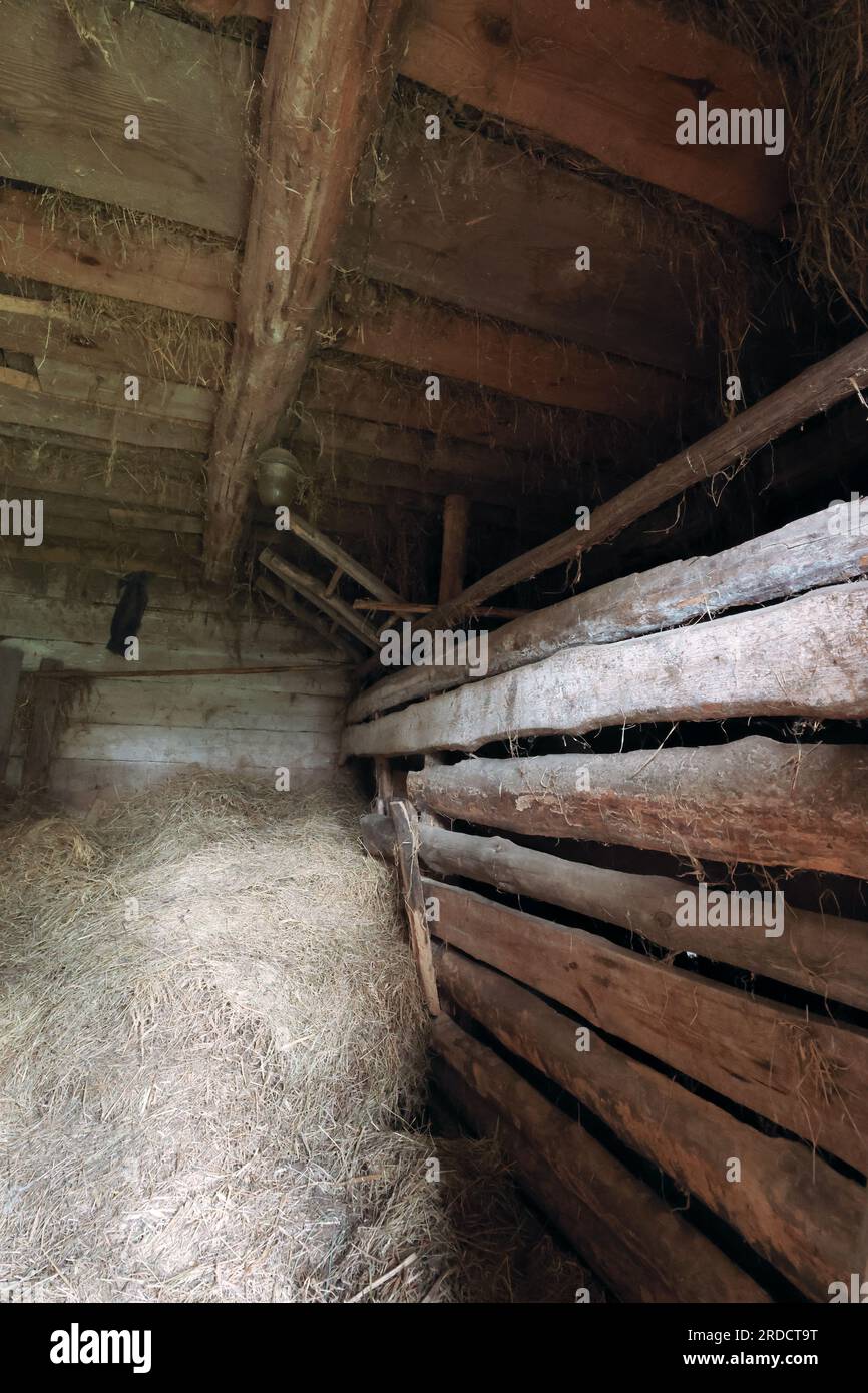 Hay in an old village barn Stock Photo - Alamy
