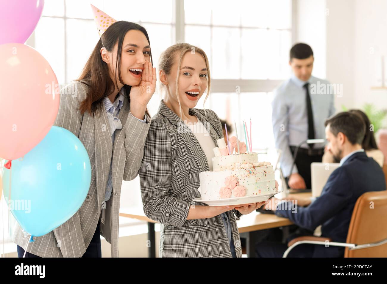 Female colleagues with Birthday cake at party in office Stock Photo - Alamy