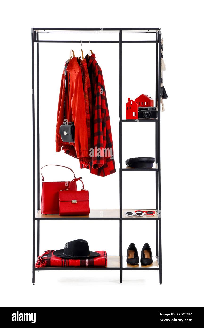 Shelving unit with clothes and accessories on white background Stock ...