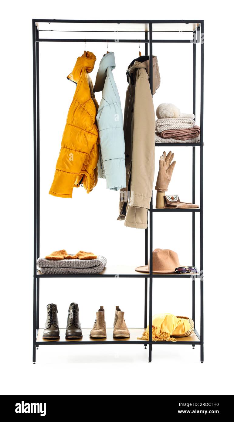 Shelving unit with clothes and accessories on white background Stock ...