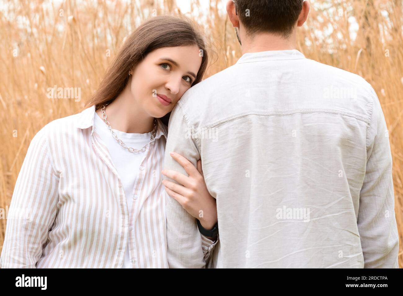 Beautiful happy loving couple hugging in field on spring day Stock ...