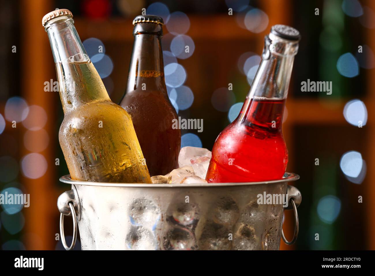 Bucket with bottles of cold beer in bar, closeup Stock Photo - Alamy