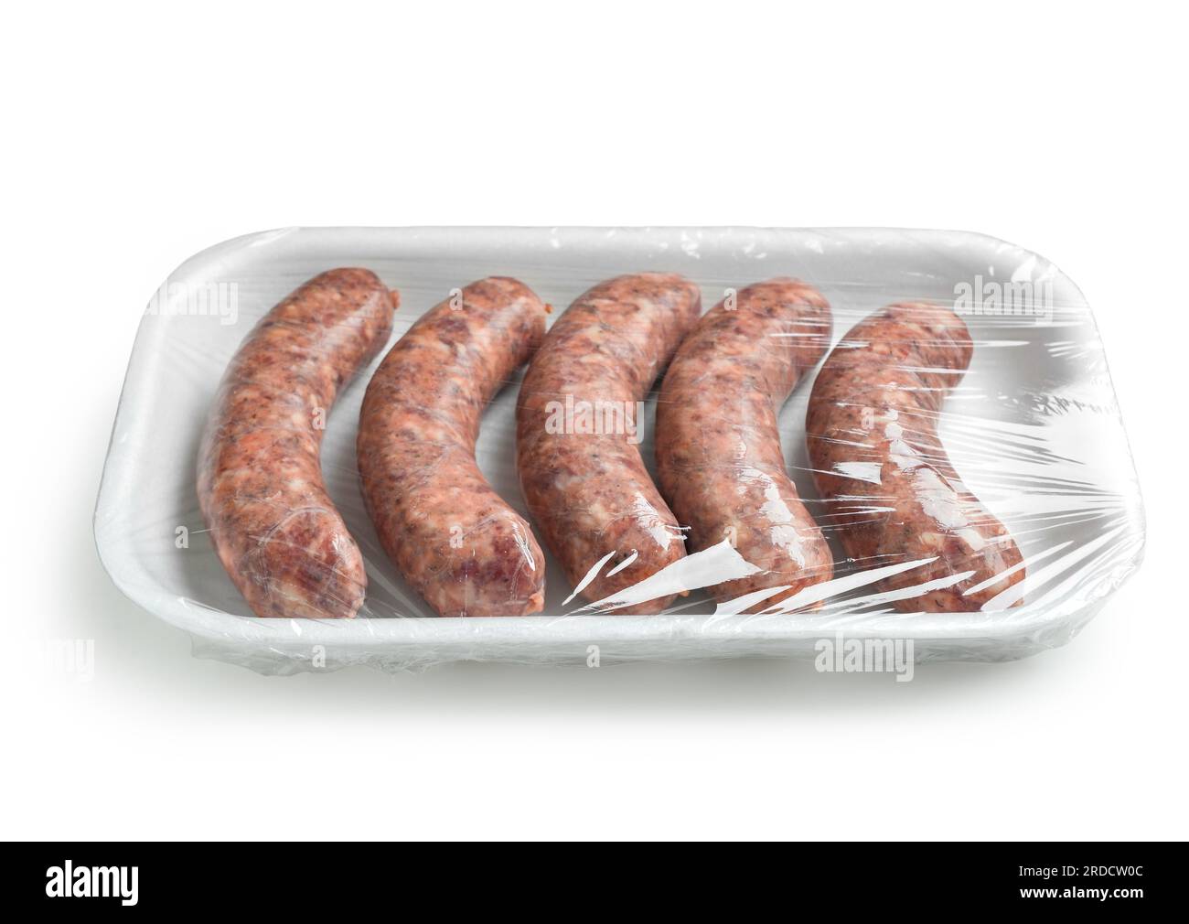Raw pork sausages in plastic packaging on white background Stock Photo ...