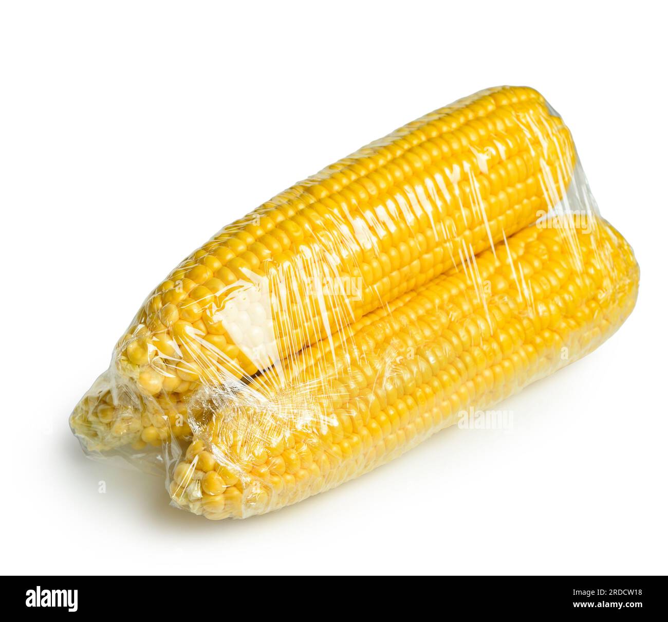 Corn in plastic food wrap on white background Stock Photo - Alamy
