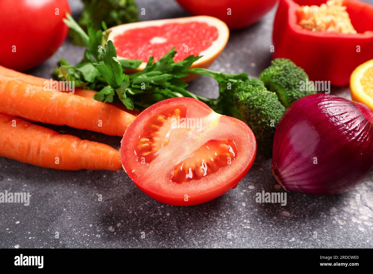 Different fresh vegetables on grey background Stock Photo - Alamy