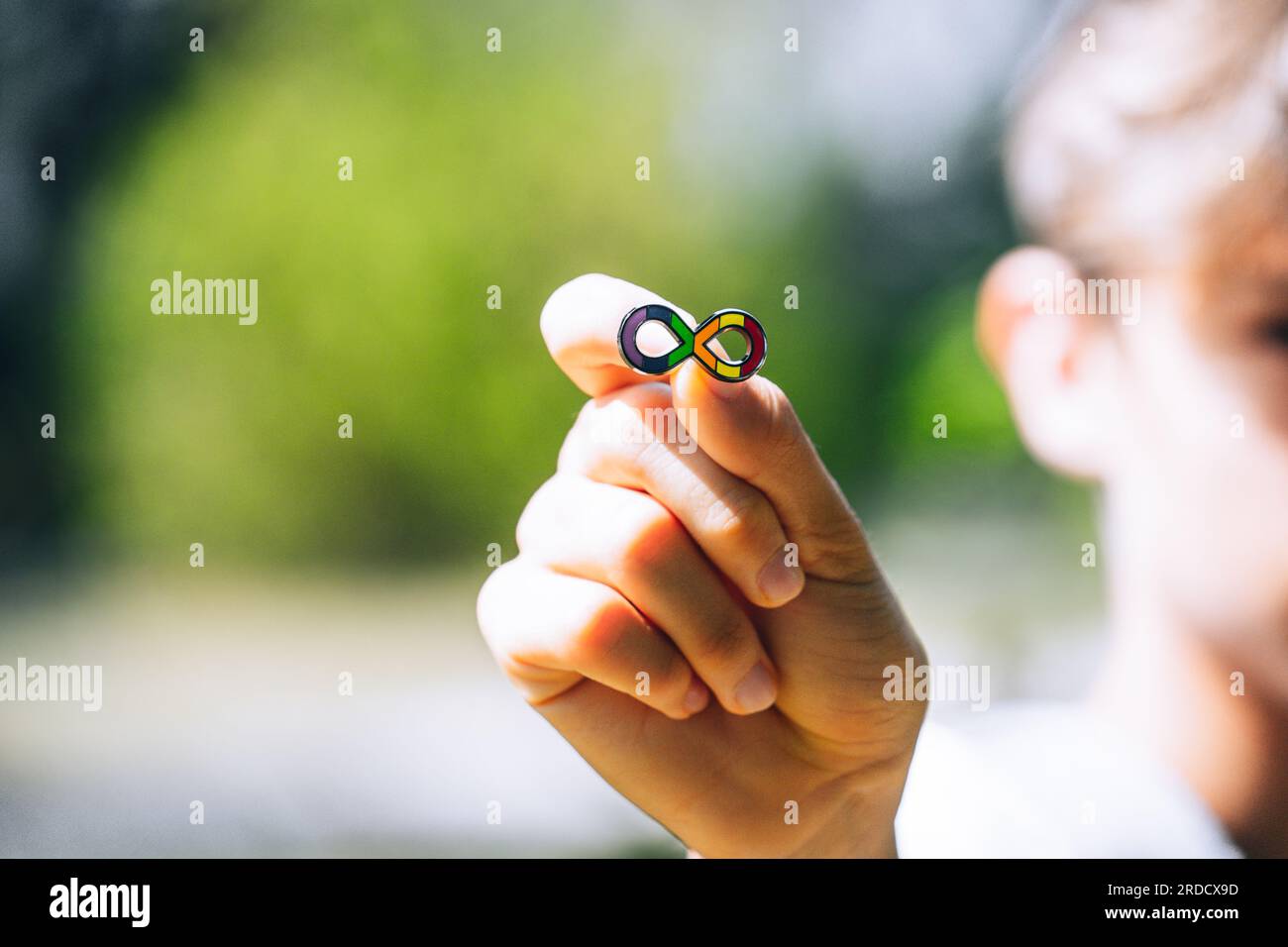 Autism infinity rainbow symbol sign in kid hand. World autism awareness ...