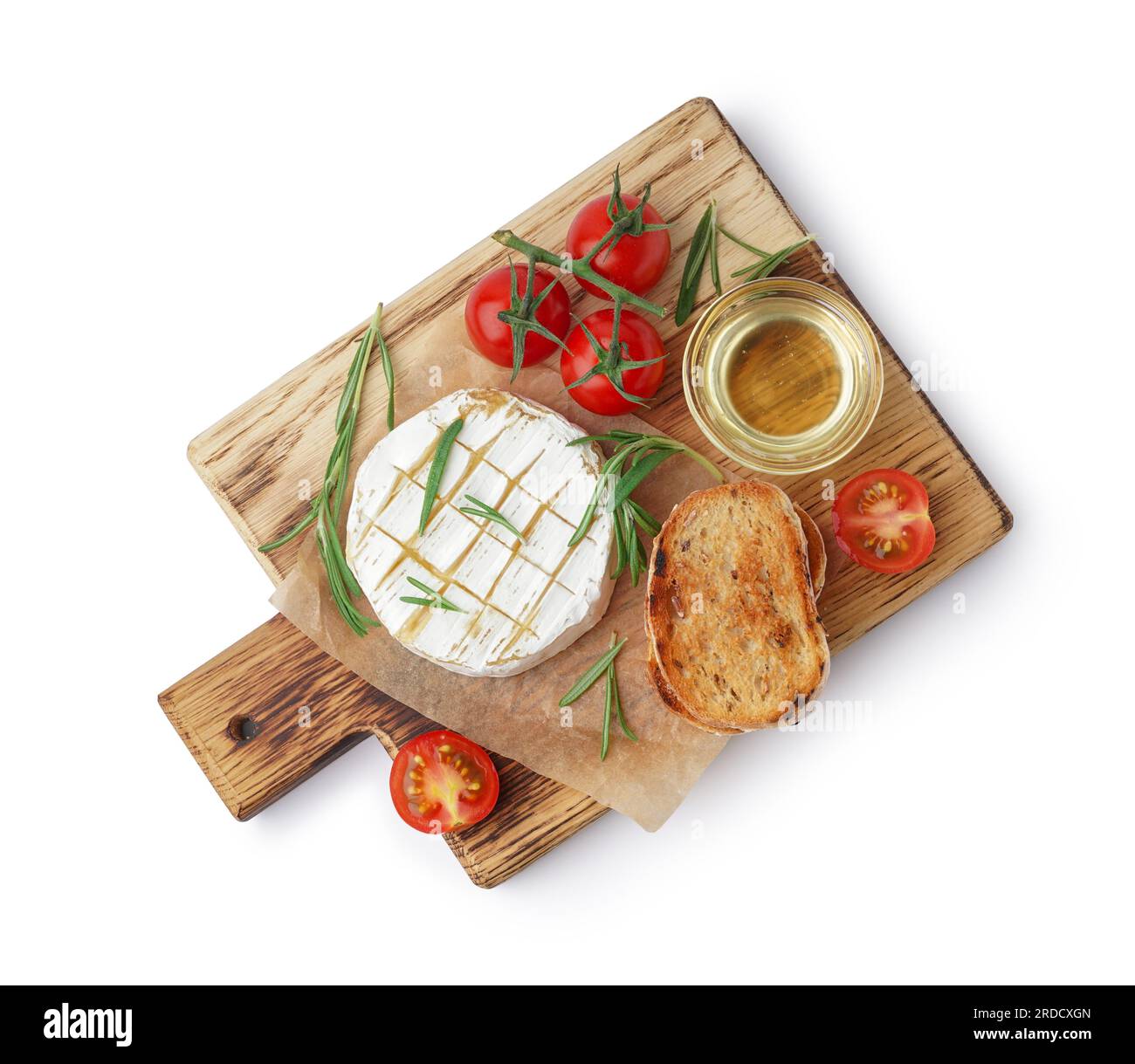 Wooden board with tasty baked Camembert cheese on white background ...
