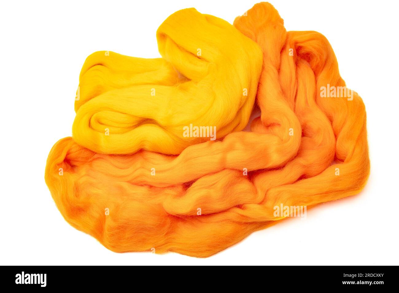 Merino wool for felting shades of yellow is isolated on a white ...