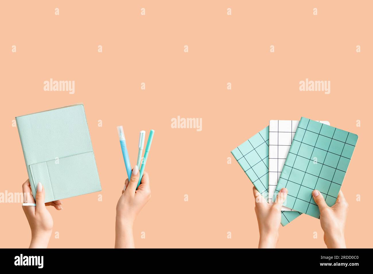 Female hands with school supplies on beige background Stock Photo - Alamy