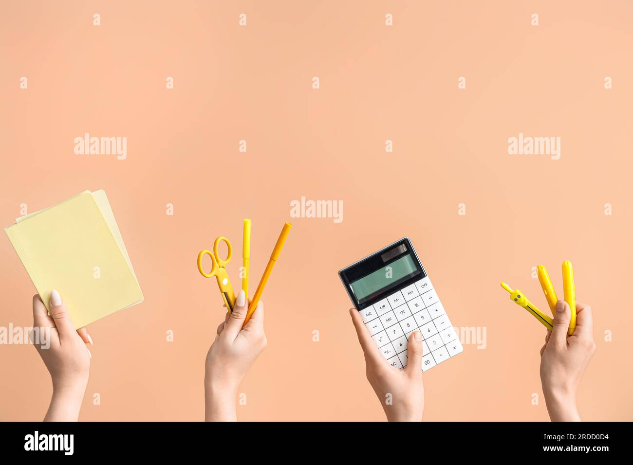 Female hands with school supplies on beige background Stock Photo - Alamy