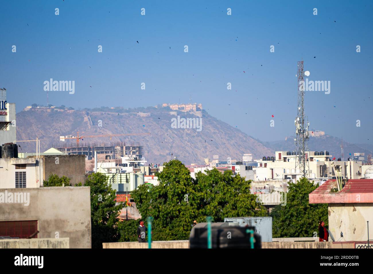 sky filled with kites with aravalli mountains hills with nahargarh fort ...