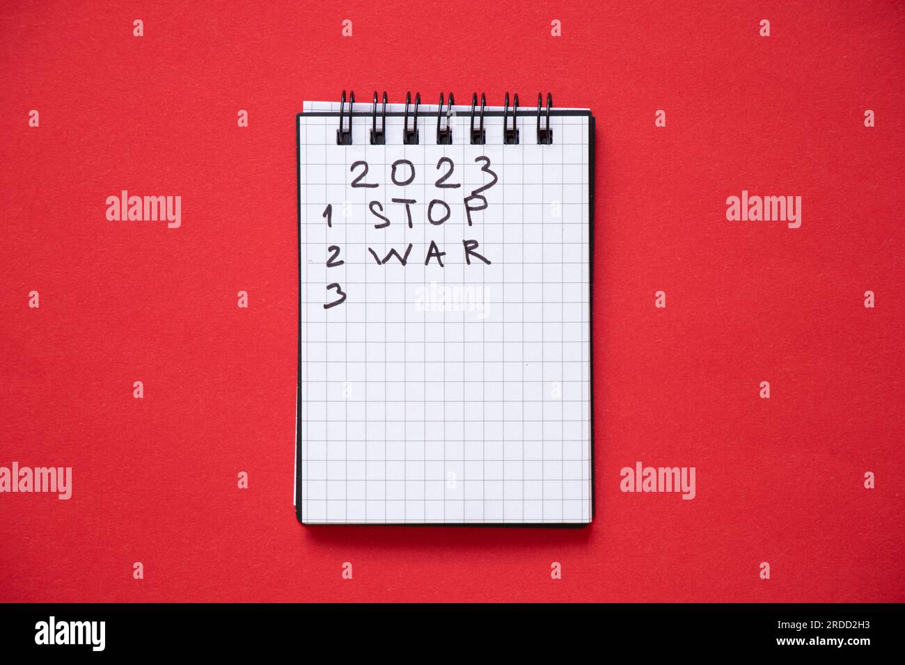 The notepad contains the year 2023 and the numbering of the numbers 123 ...