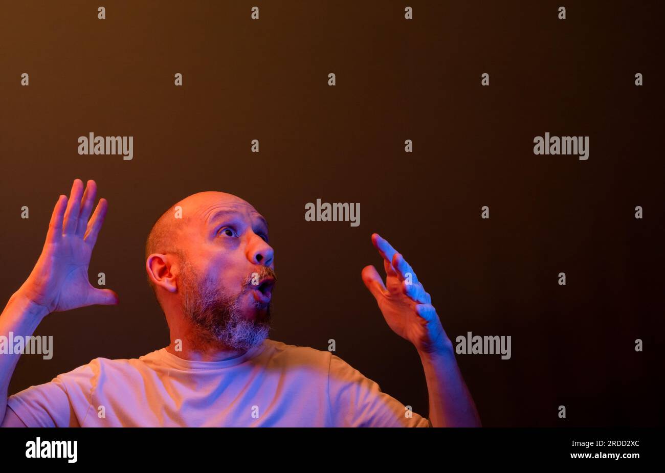 Happy bald bearded man making funny hand gestures. Concept of strength ...