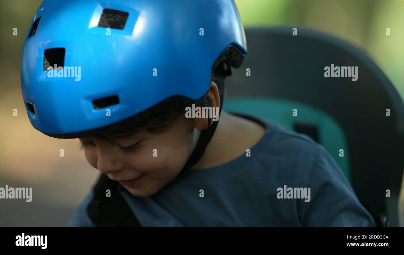 One happy little boy wearing bicycle helmet portrait face clapping ...