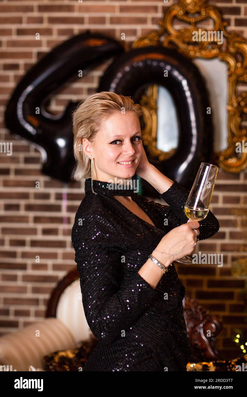Beautiful woman of 40 years with gifts Stock Photo - Alamy