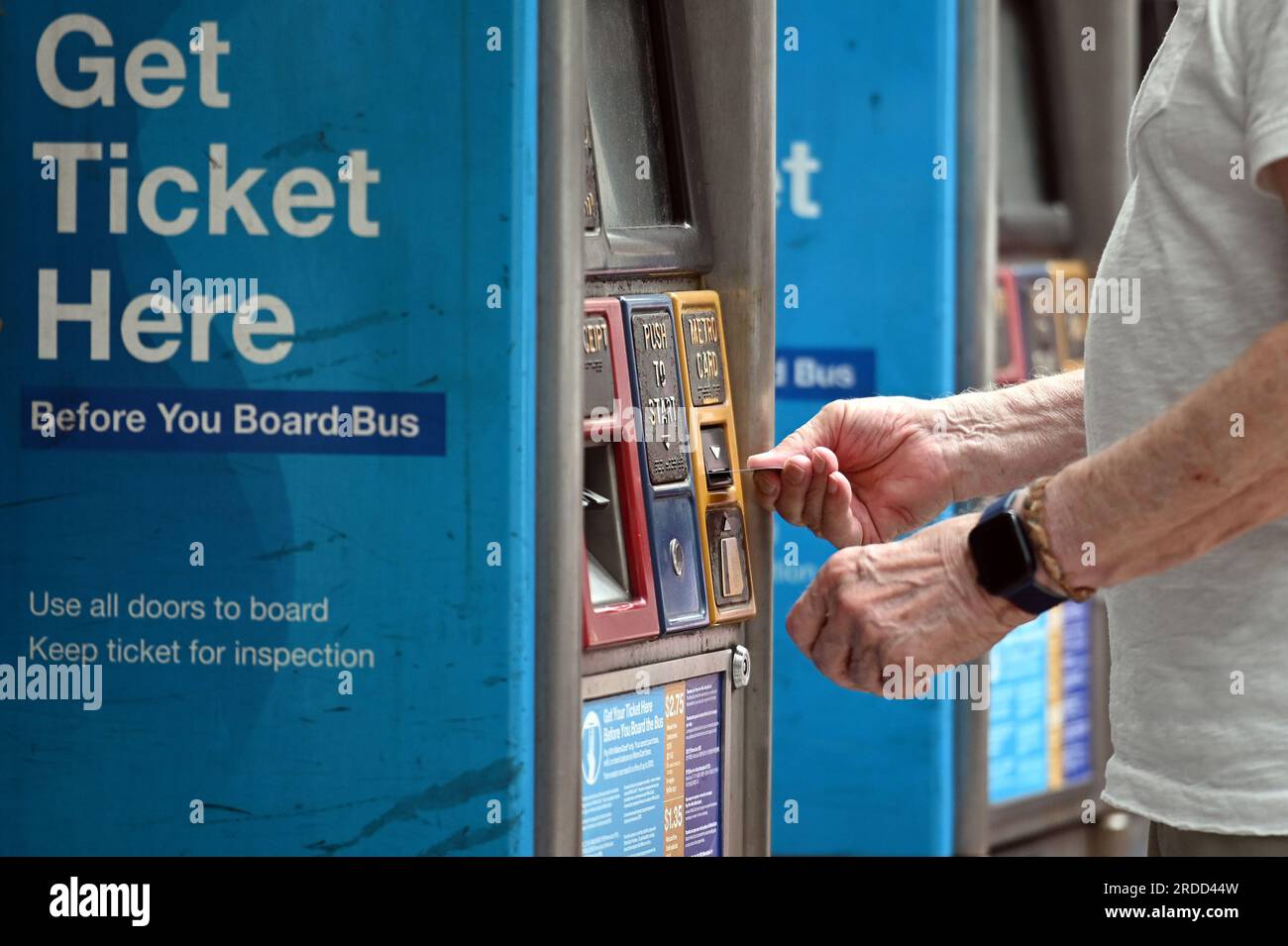 New York, USA. 20th July, 2023. A commuter pays for a bus pass as the ...