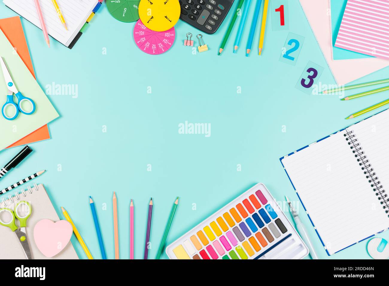 Back to school background. Colored pencils, books, notebooks, pens ...