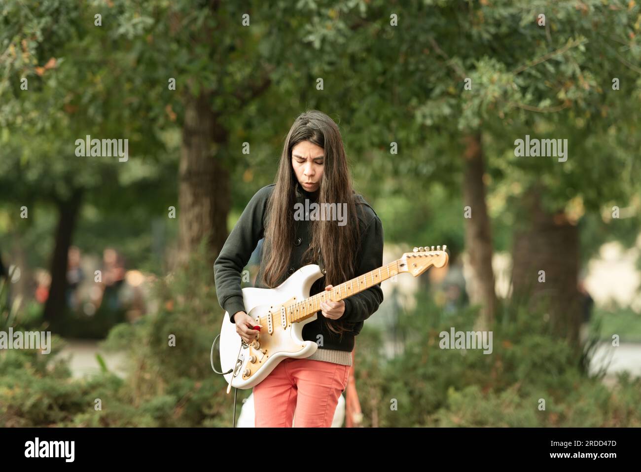 Santiago, Chile - A street musician playing electric guitar at the ...