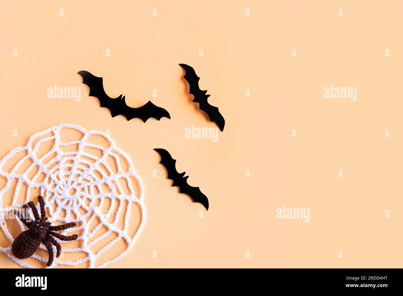 Composition of black bats and a knitted spider. Halloween concept Stock ...