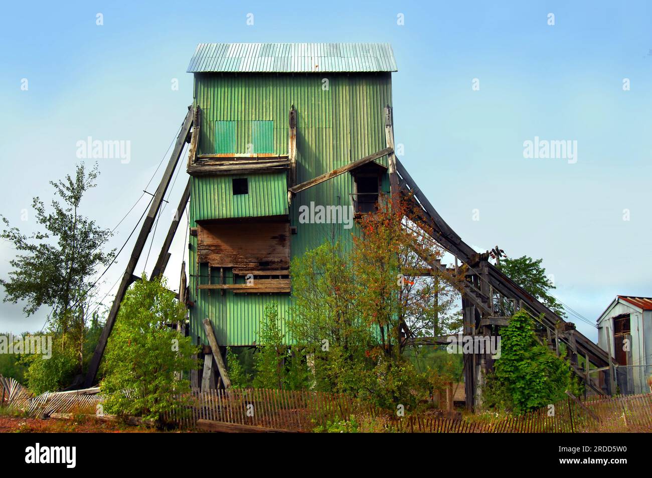 Abandoned shaft house, stands rusting and deteriorating. House is part ...