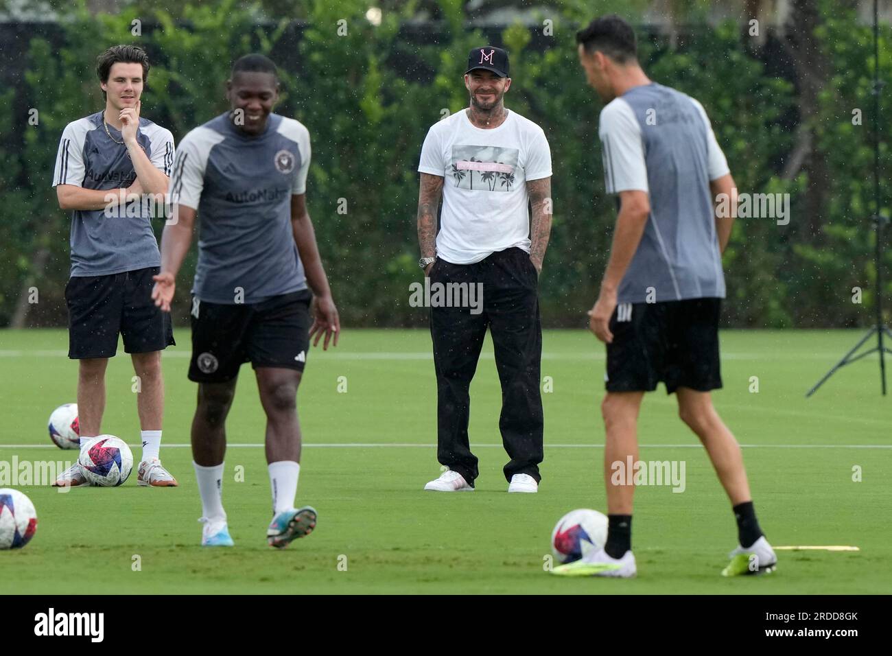 Inter Miami co-owner David Beckham, center, watches players practice ...