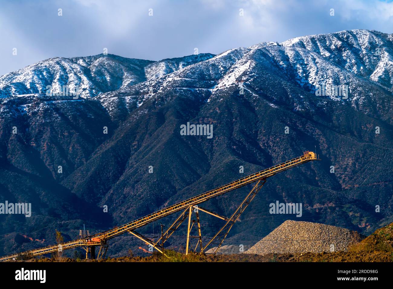 Belt conveyor at quarry mining and aggregate processing site just below ...