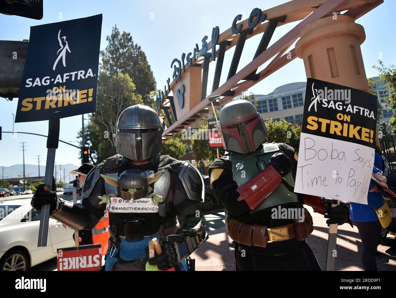 Tim Brehmer, left, and a fellow picketer dress as characters from "The ...