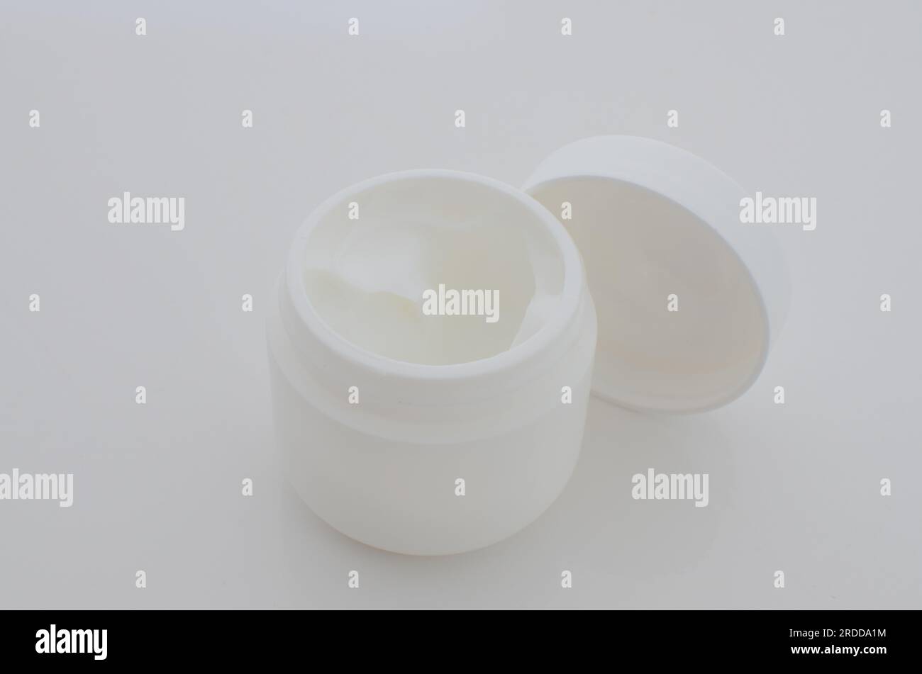 Detail of a pot of white cream, representing aesthetic care and skin ...