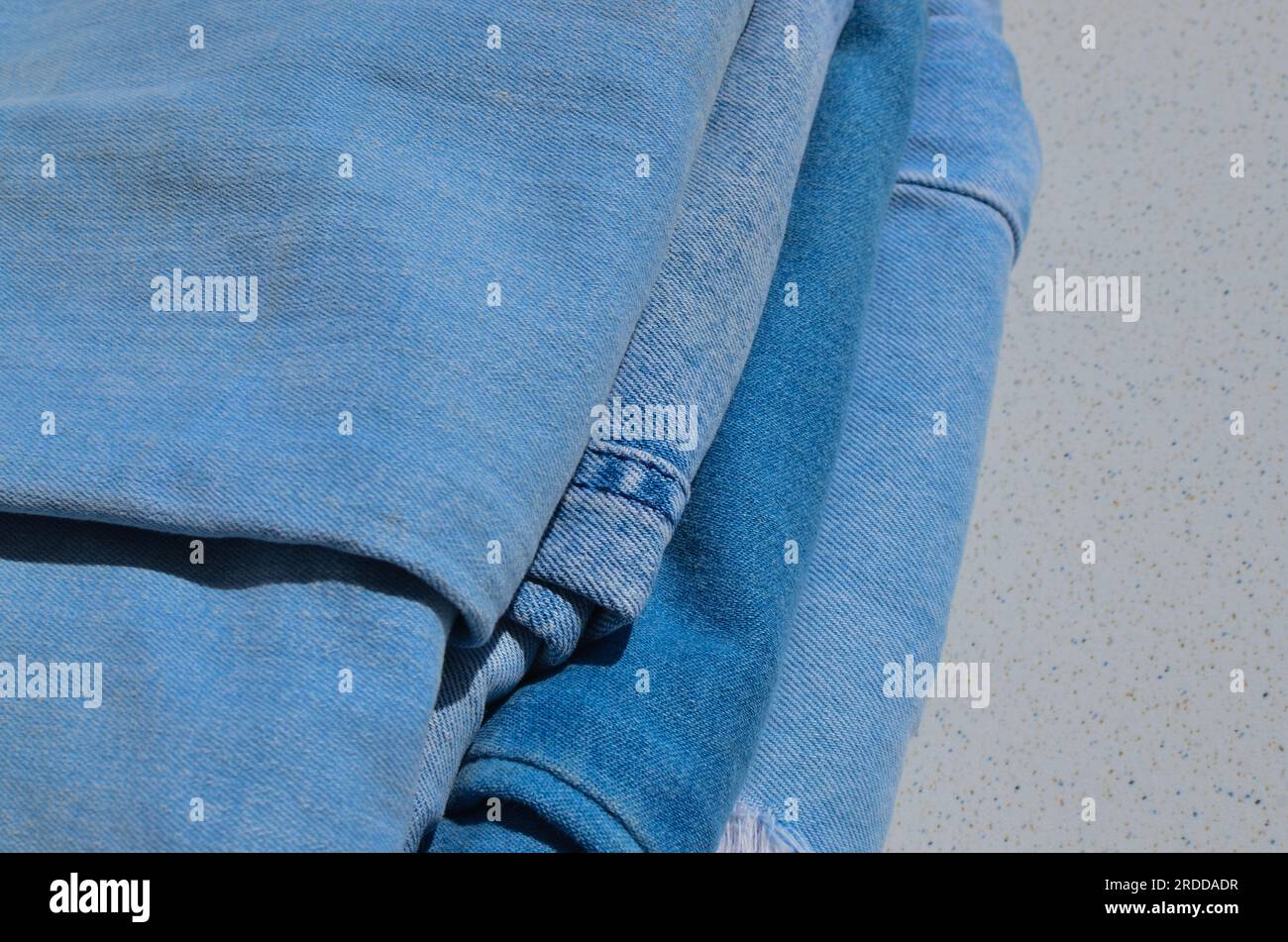 Close-up detail of jeans, highlighting the texture of the fabric and ...