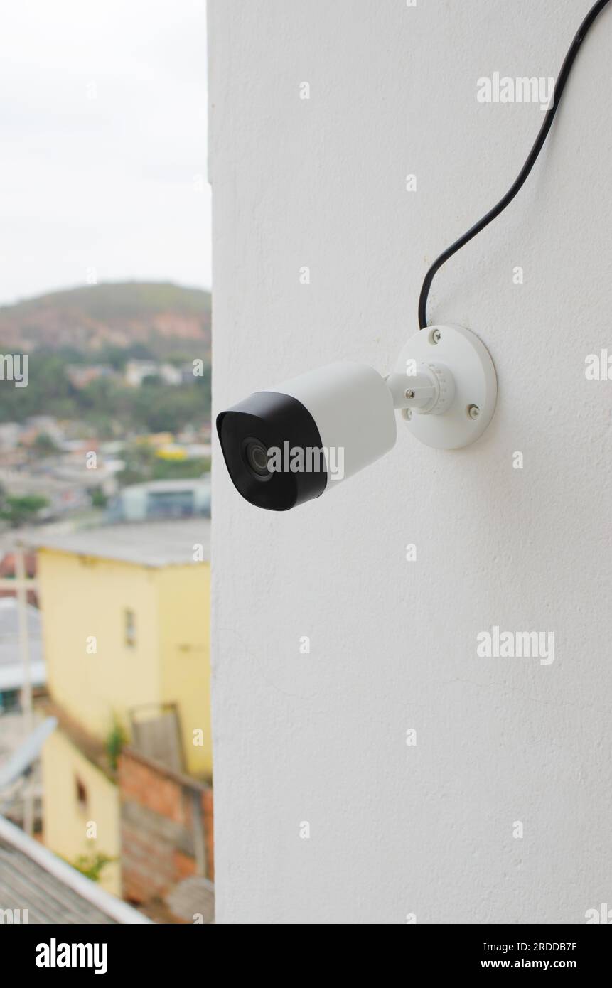 Close-up of security camera on balcony, accurately monitoring every ...