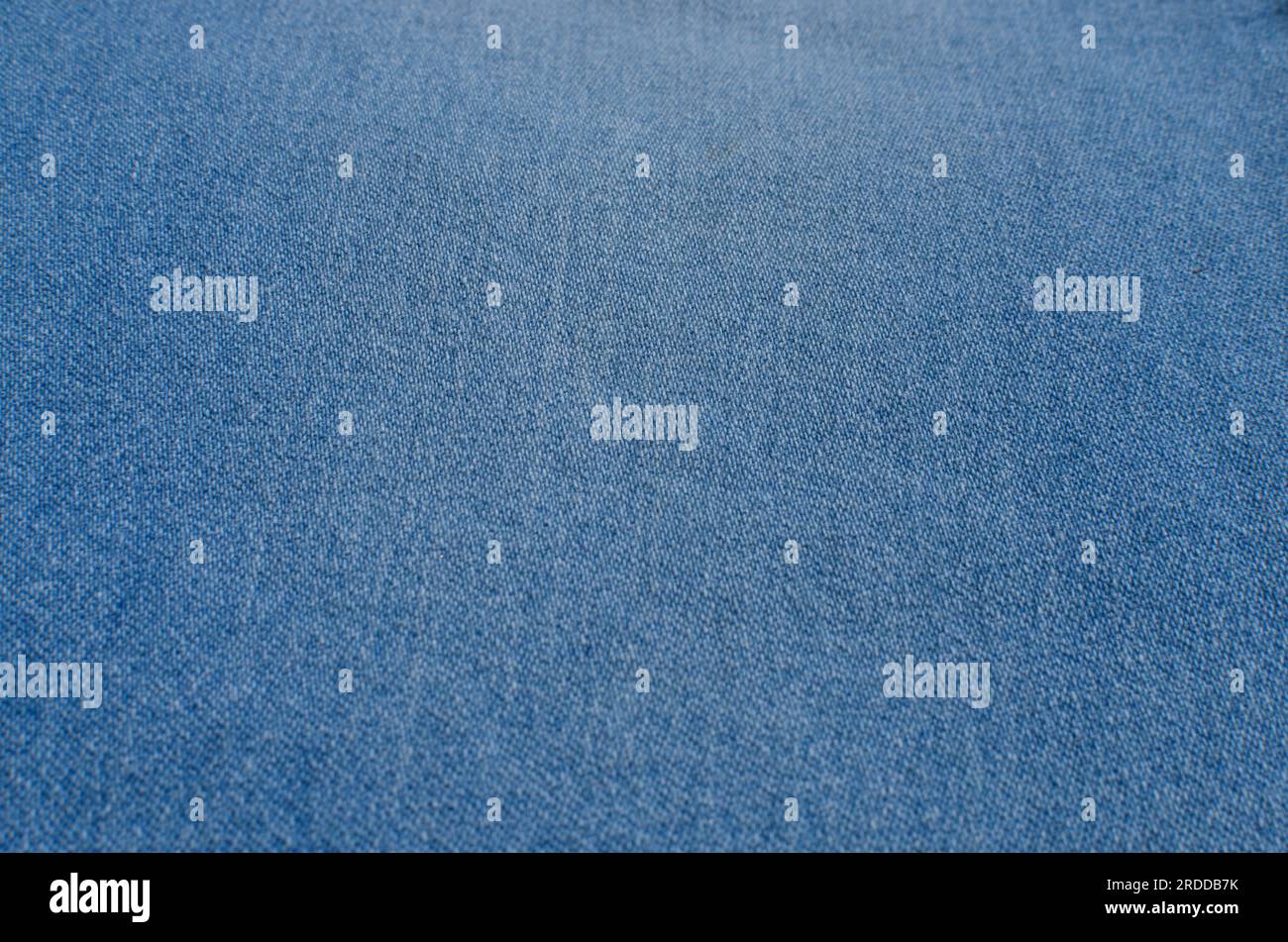 Closeup of distressed blue denim texture with intertwined lines ...