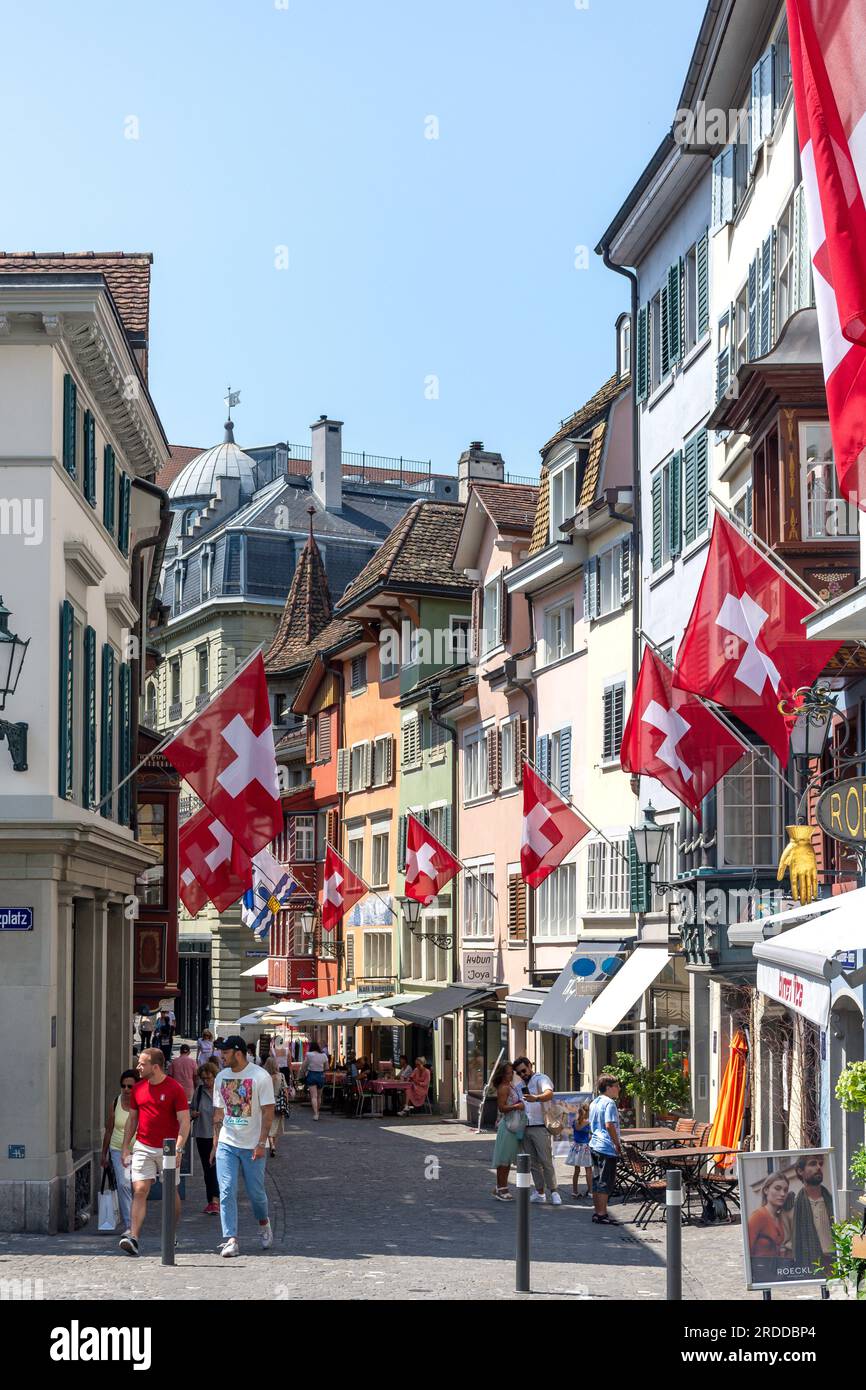 Pedestrianised street with Swiss flags, Augustinergasse, City of Zürich ...